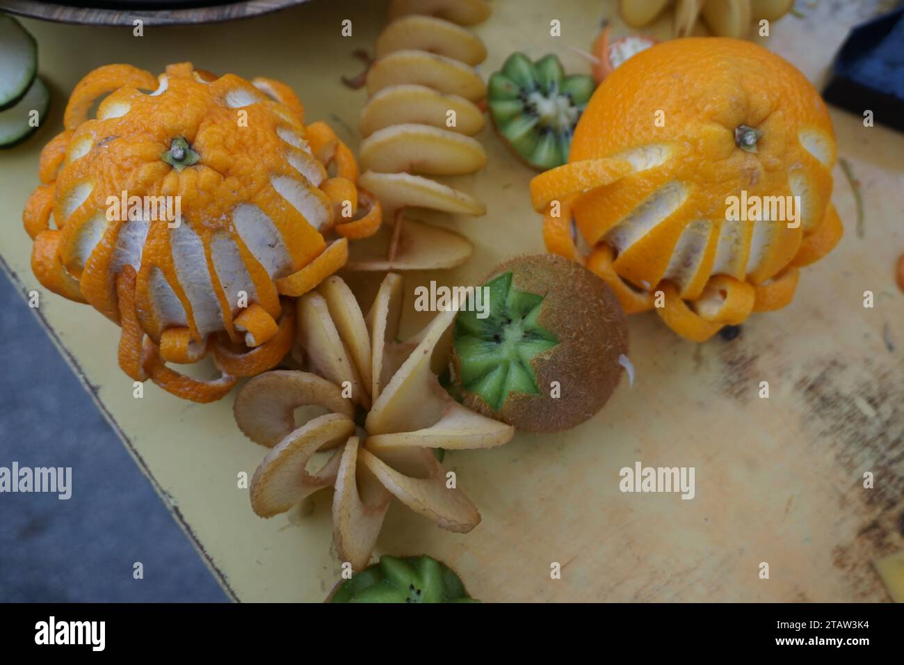 closeup of artfully cut up fruits on display for the sale of the device ...