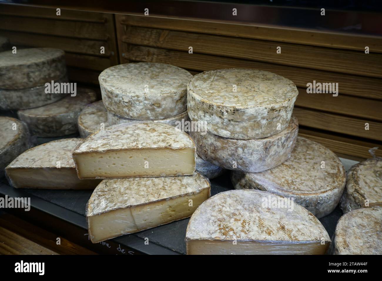 closeup of yummy country cheeses on display for sale in a store in ...