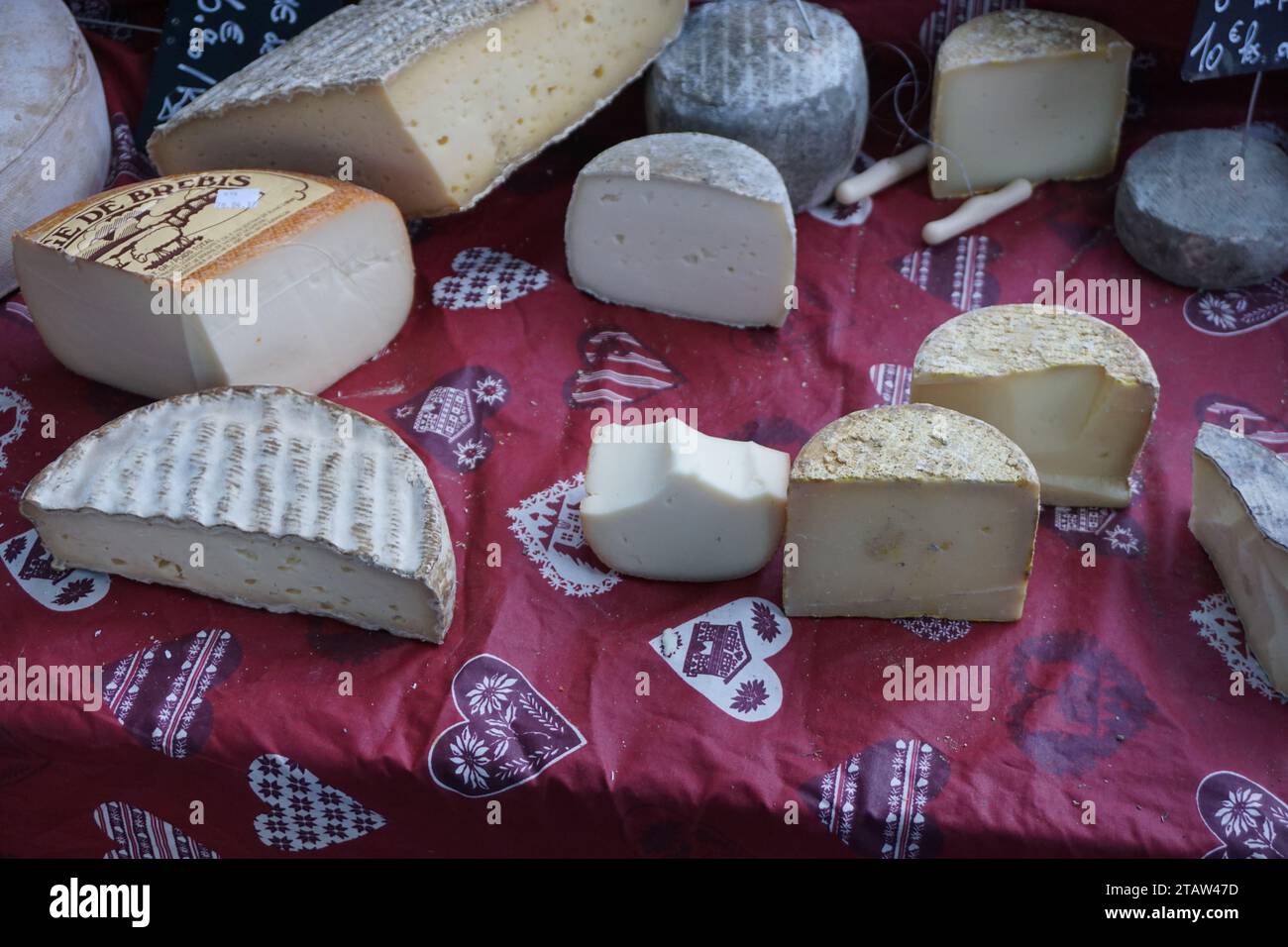closeup of yummy country cheeses on display for sale at the market in ...