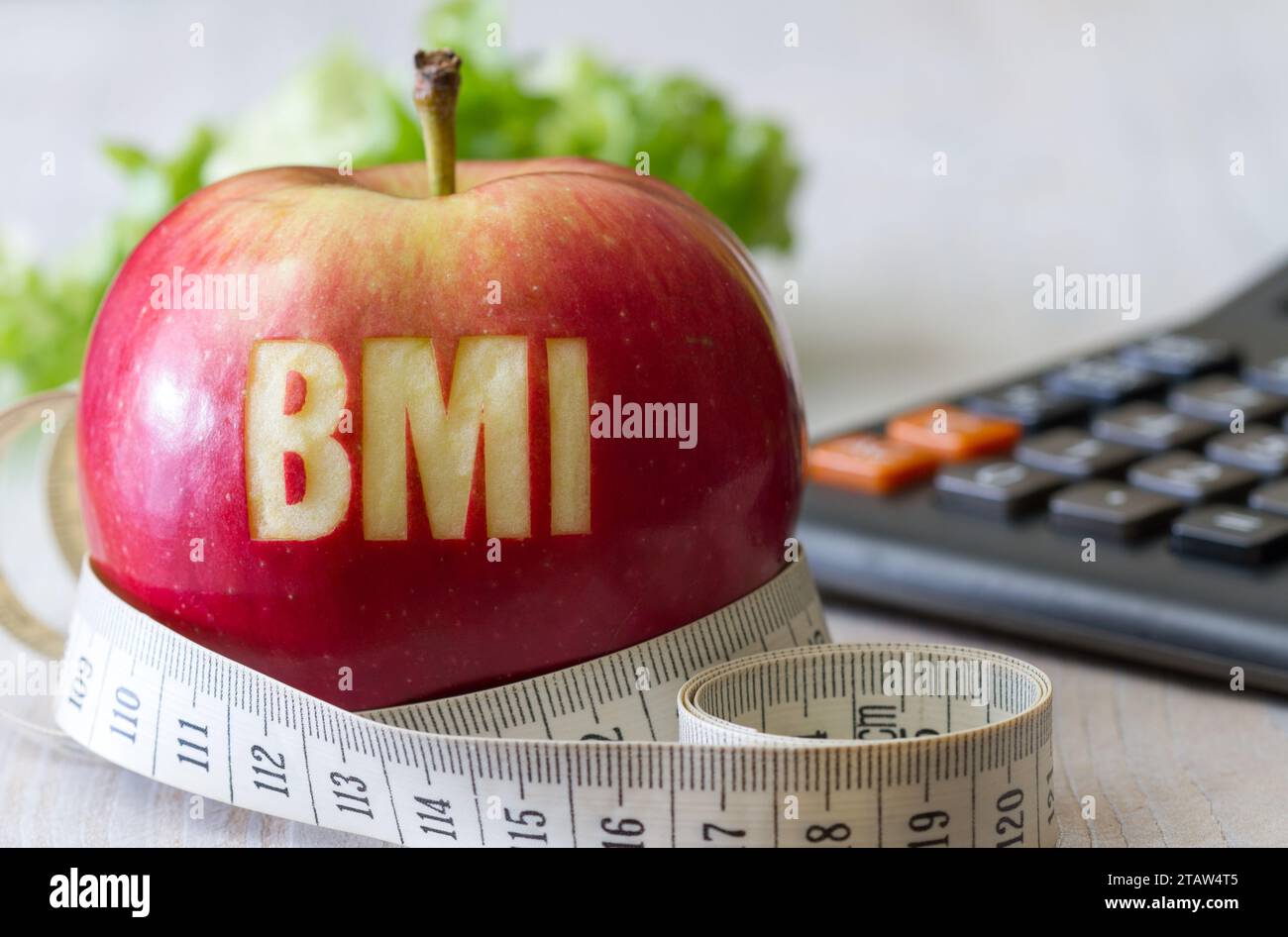 Red apple with text BMI, measuring tape and calculator, diet and ...