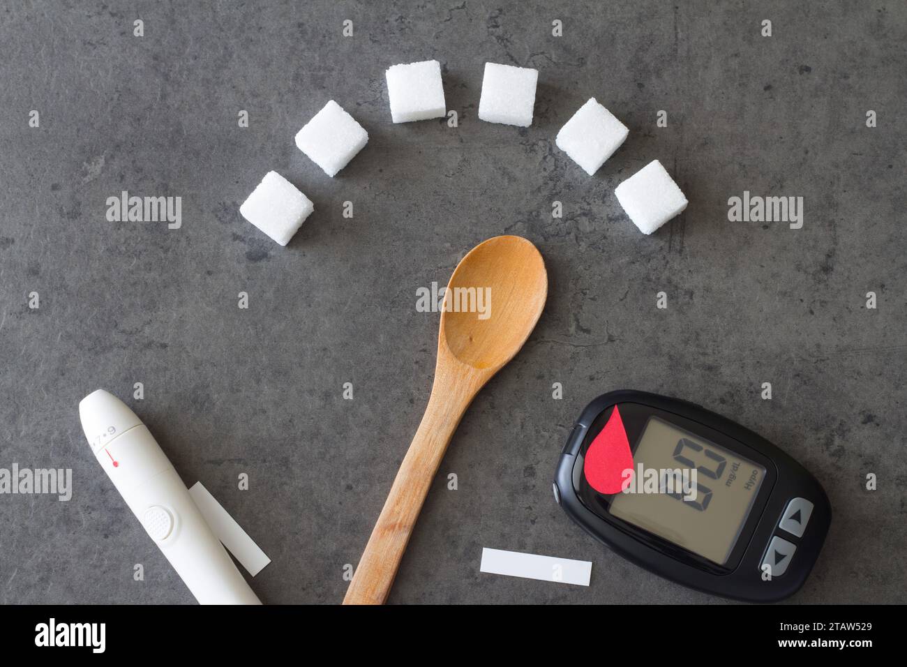 Sugar cubes with spoon indicating high sugar level, red blood drop and ...