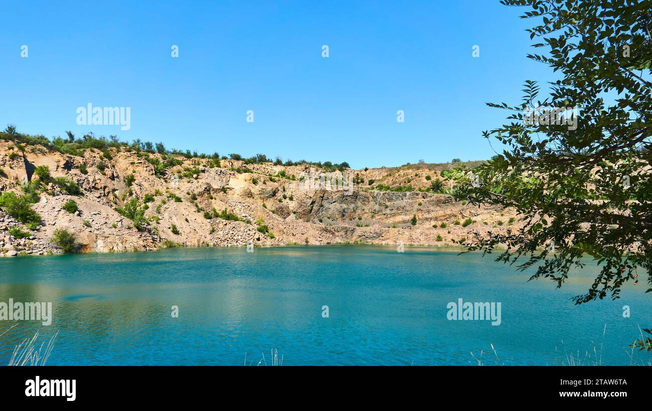 Old abandoned quarry lake filled with emerald water with radon Stock ...