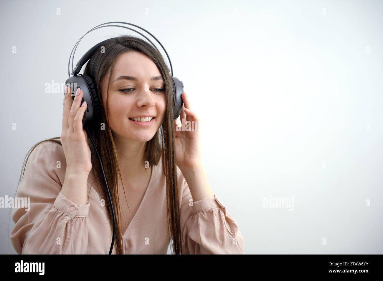 girls in headphones listening to music satisfied smile on face eyes ...