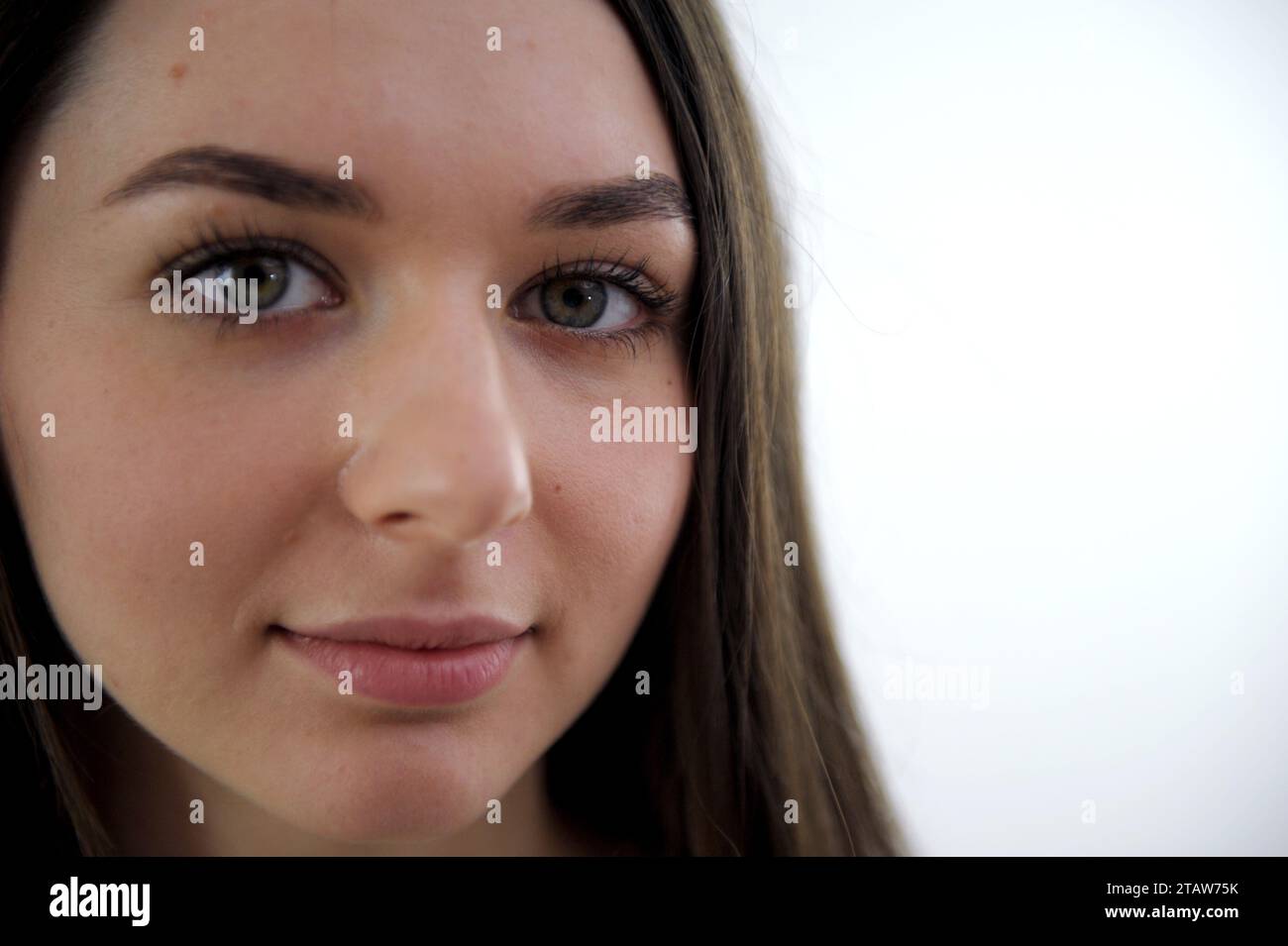 beautiful face of a young girl big high forehead long hair lips bow ...