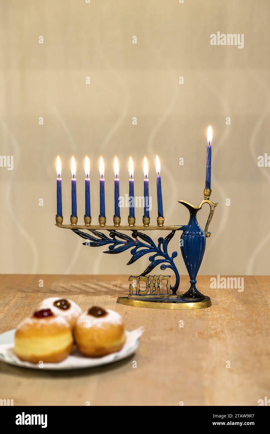 Menorah with lit burning candles for Jewish Hanukkah holiday on table ...
