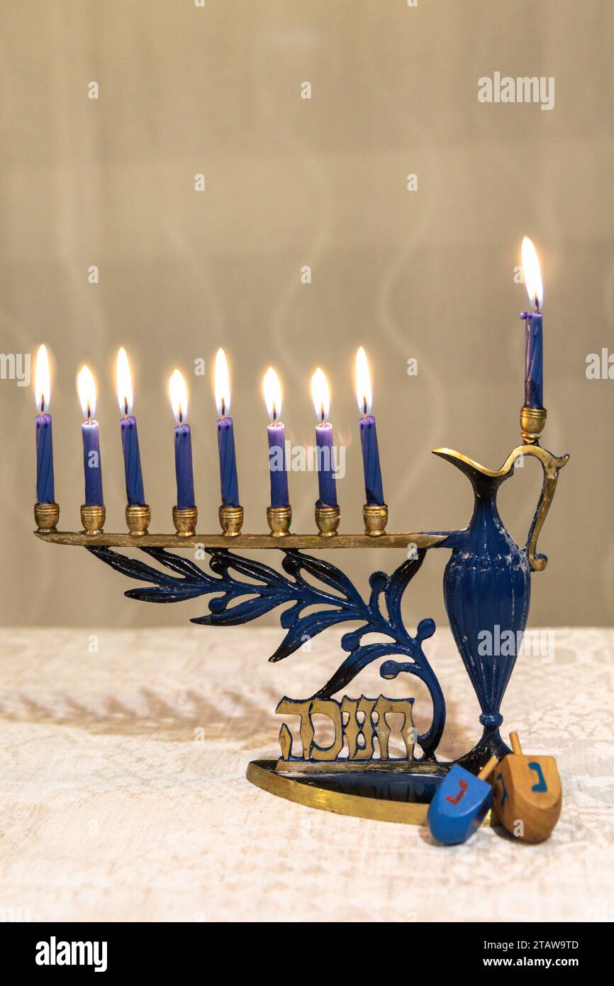 Menorah with lit burning candles for Jewish Hanukkah holiday on table ...