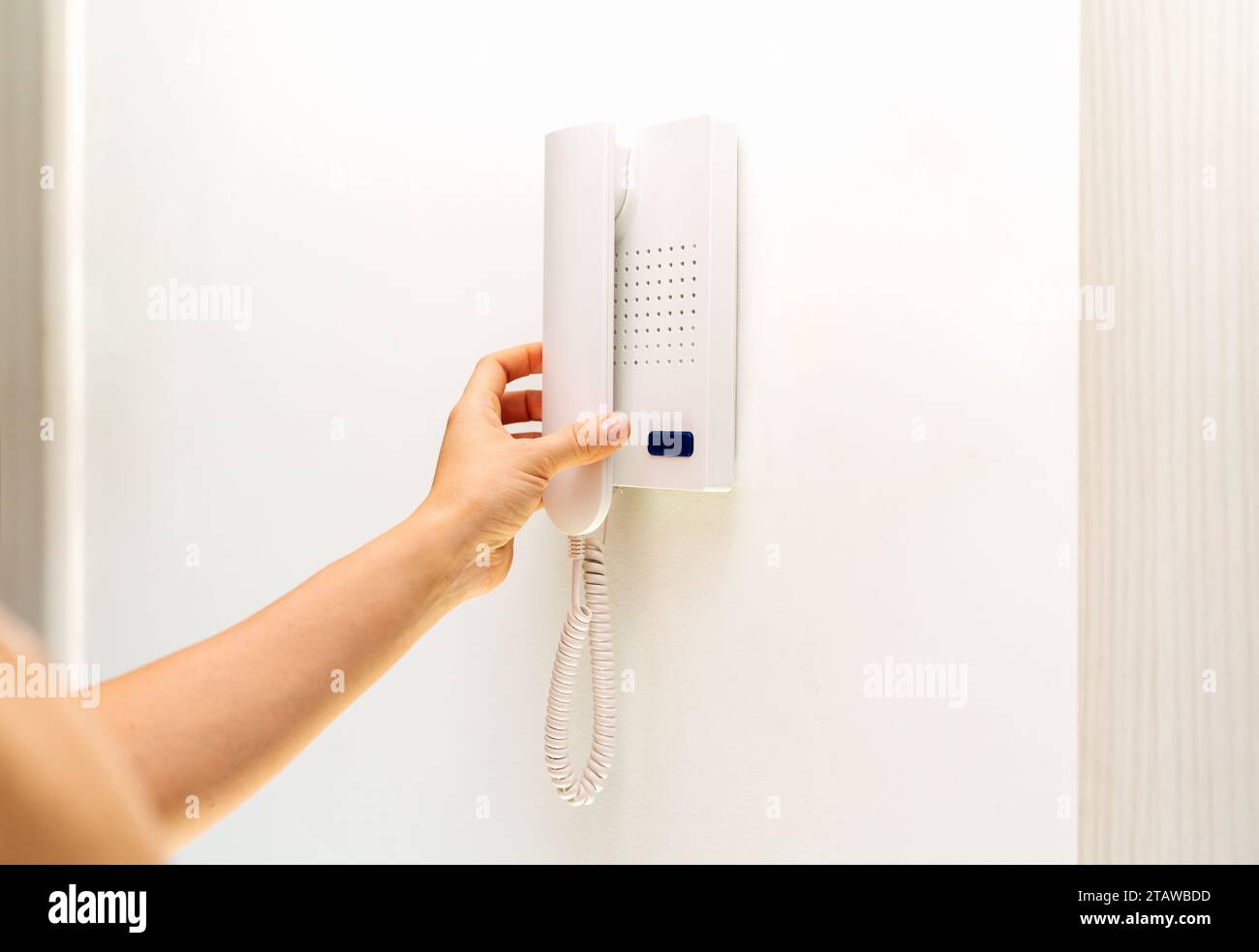 Female person using intercommunication device at her appartment Stock ...