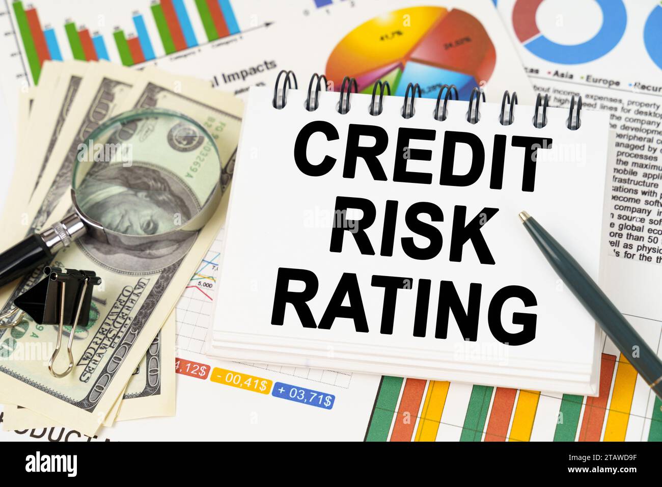 Business concept. On the table are business charts, dollars and a notepad with the inscription ...