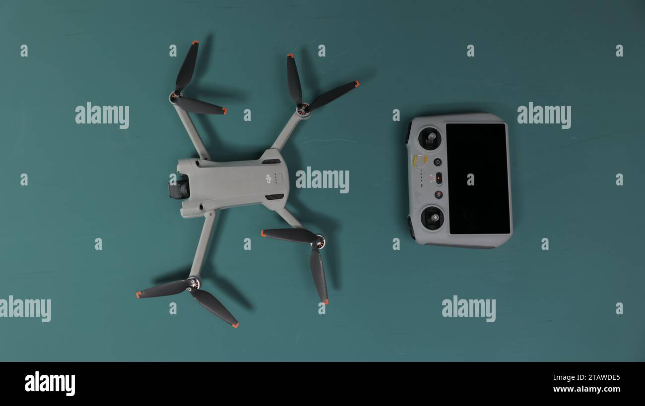 DJI Mini 3 Pro drone isolated on a dark blue background Stock Photo - Alamy