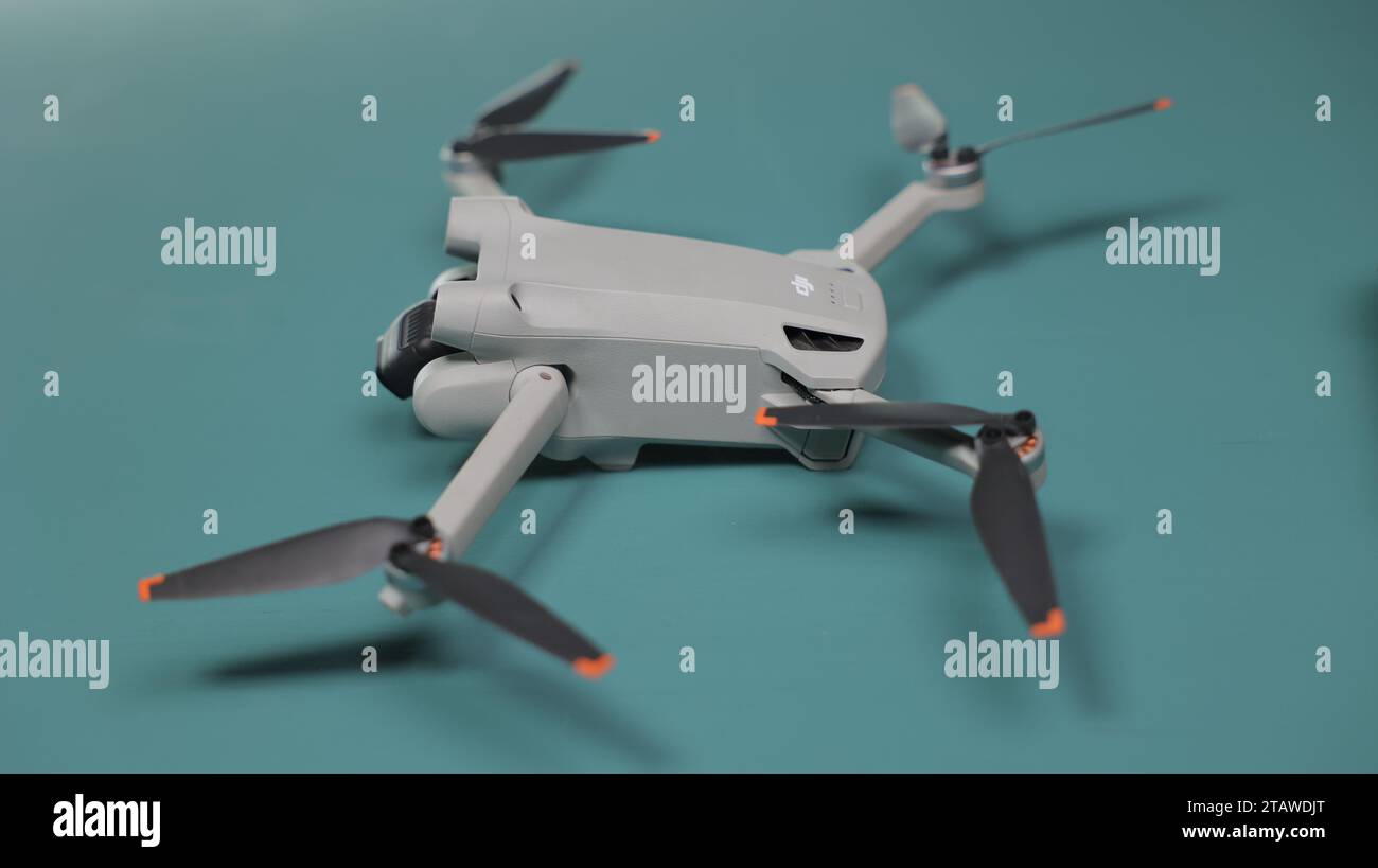 DJI Mini 3 Pro drone isolated on a dark blue background Stock Photo - Alamy