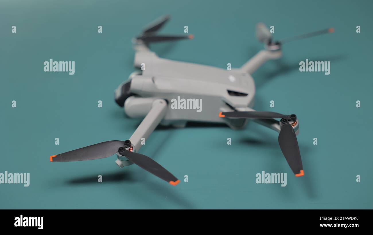 DJI Mini 3 Pro drone isolated on a dark blue background Stock Photo - Alamy