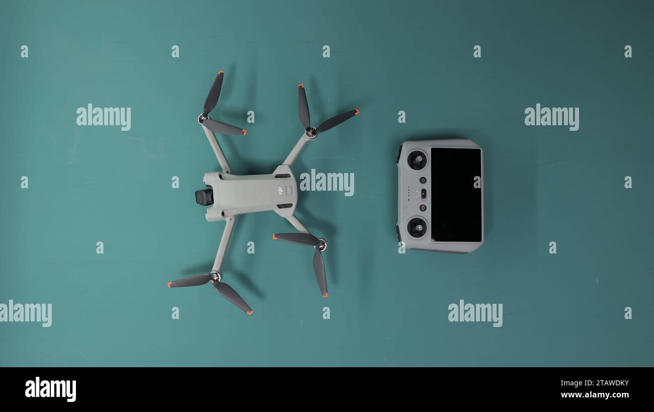 DJI Mini 3 Pro drone isolated on a dark blue background Stock Photo - Alamy