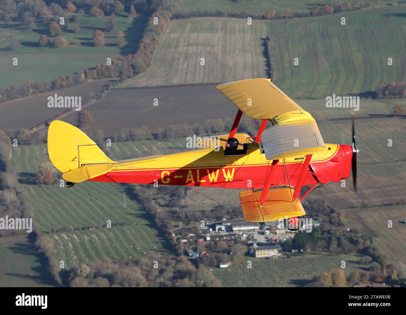 An old 1943 DH82A Tiger Moth in the skies over Warwickshire Stock Photo ...