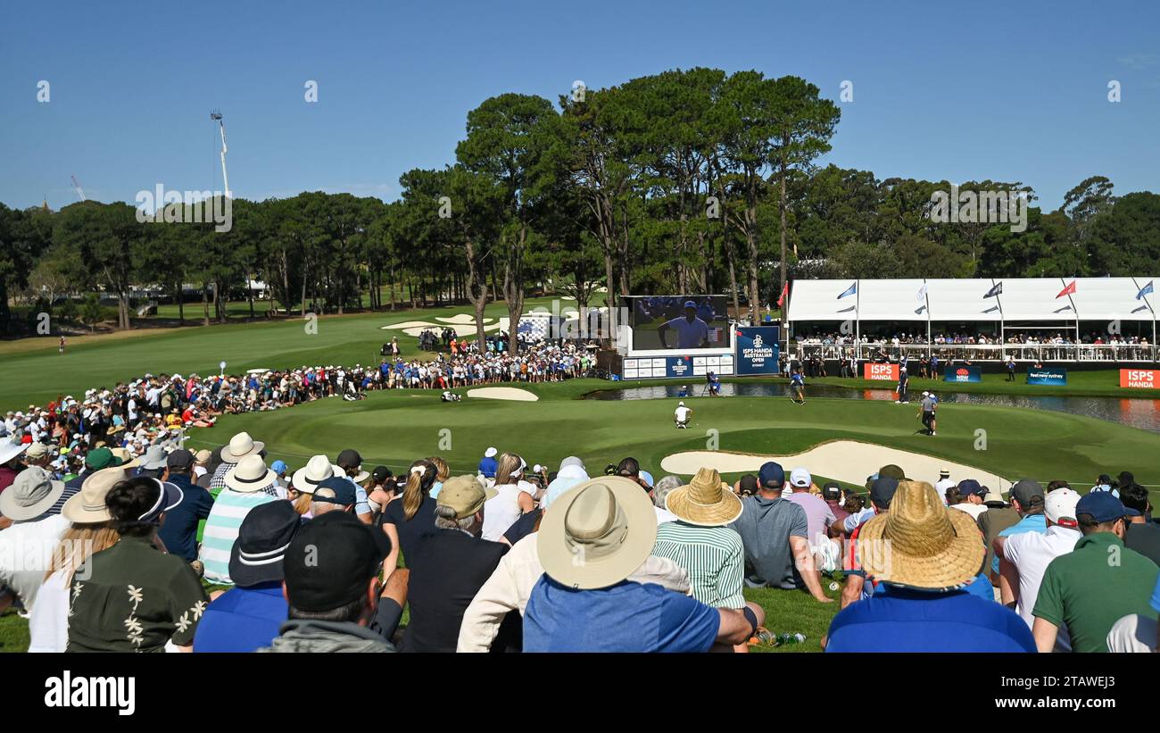 Spectators watch the play at hole 18 during the final round of the ...