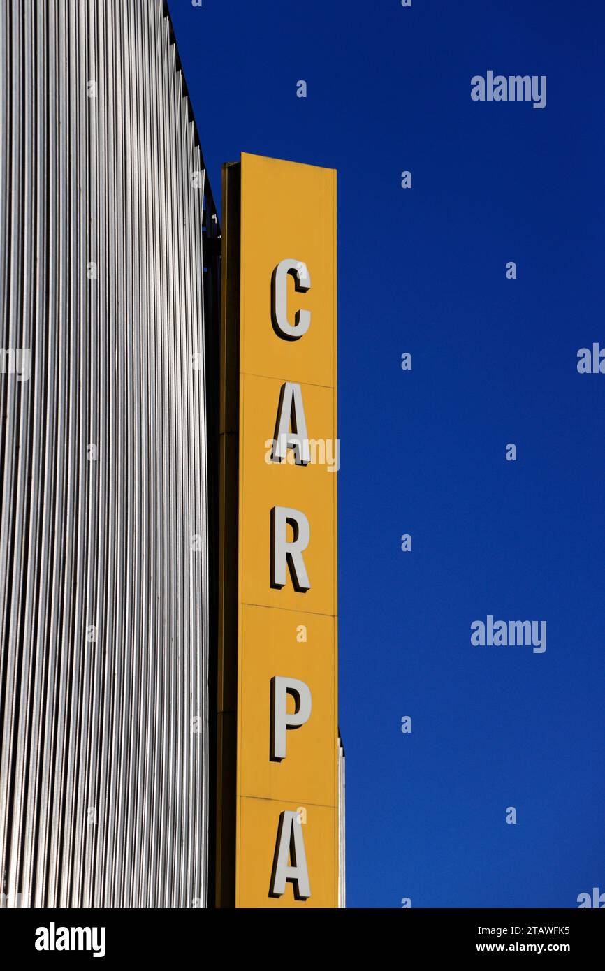 Yellow car park sign on aluminium building facade, multi storey car ...