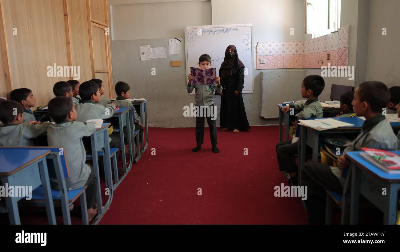 Education in Afghanistan: Schools in impoverished countries, schoolboys in a classroom in an ...