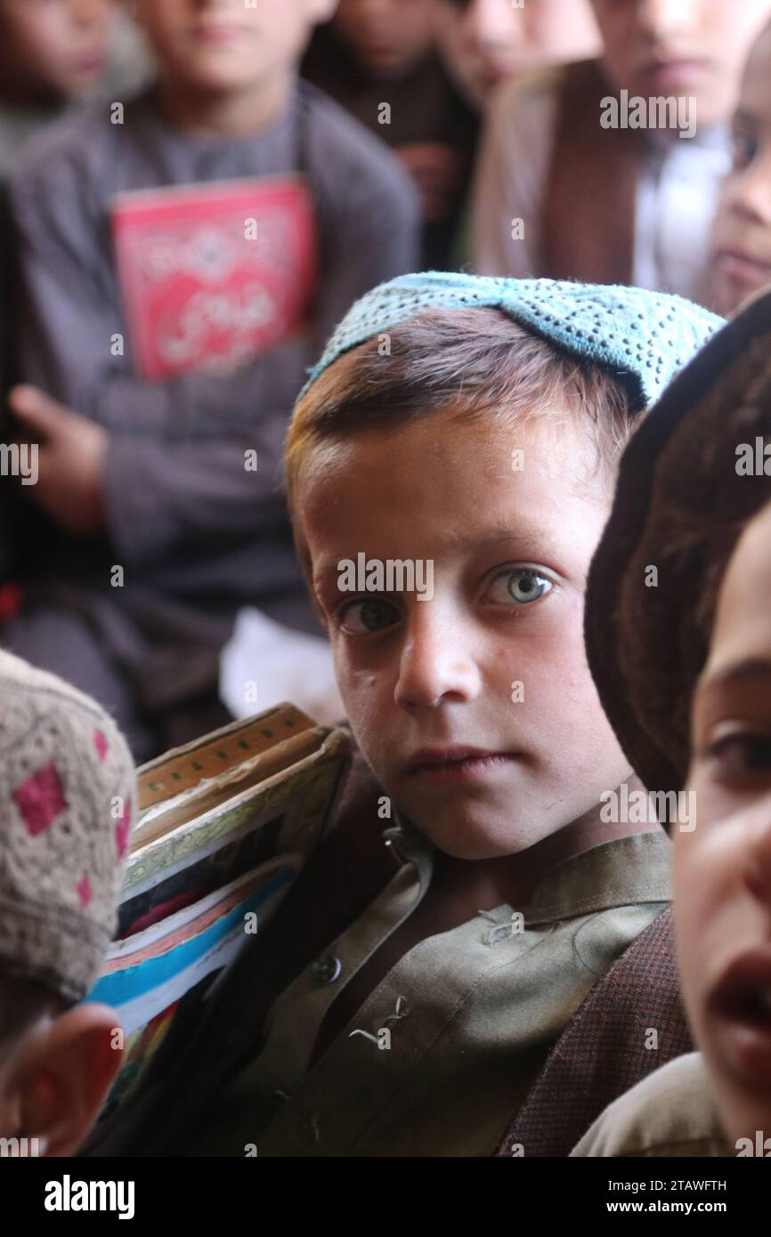 Education in Afghanistan: Schools in impoverished countries, schoolboys in a classroom in an ...