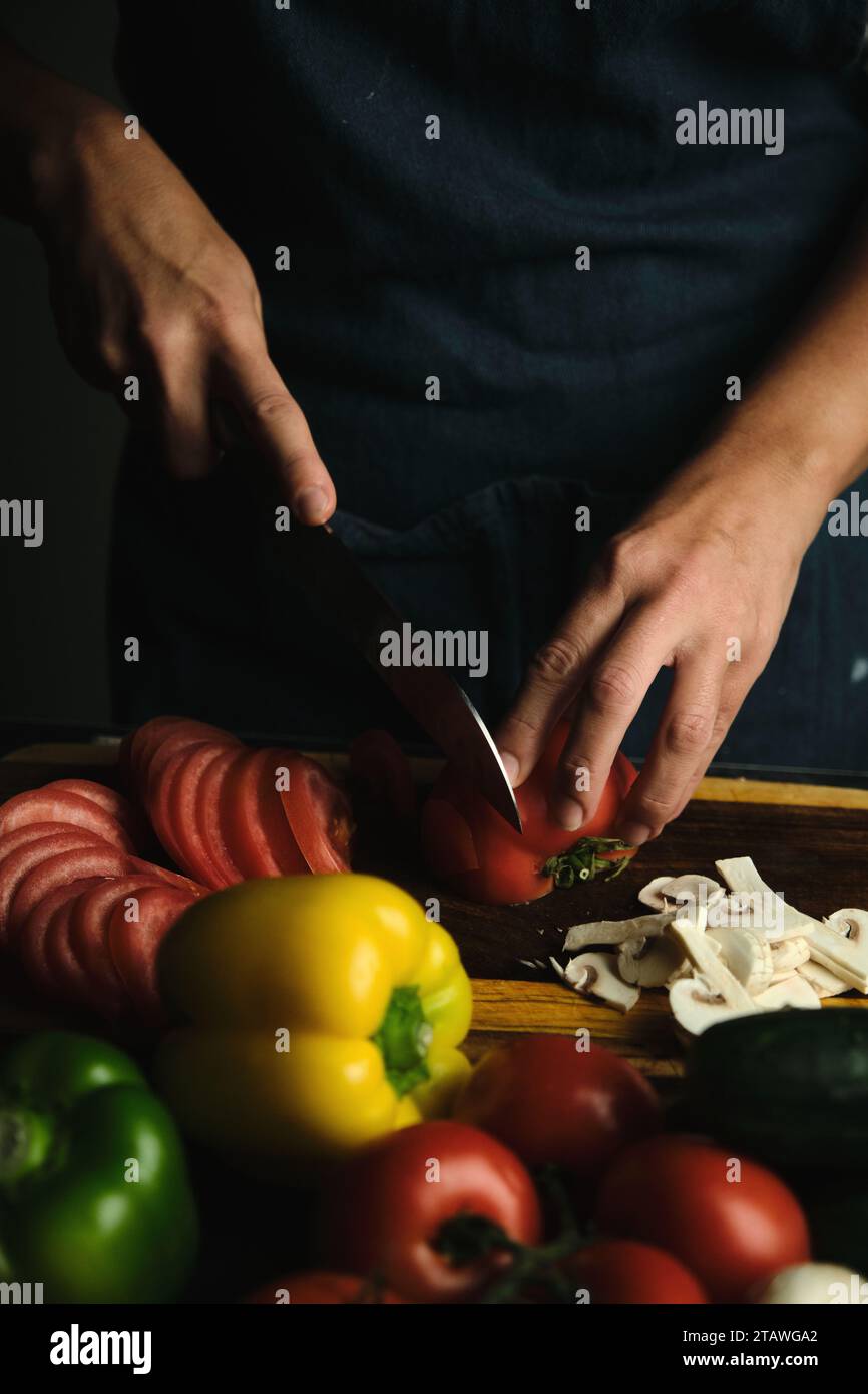 Closeup cooks hand slicing fresh hi-res stock photography and images ...