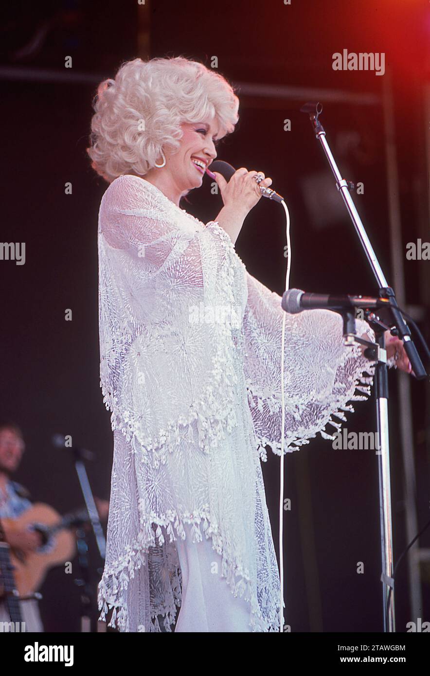 Superstar Dolly Parton performing onstage at a concert during her 1978 ...
