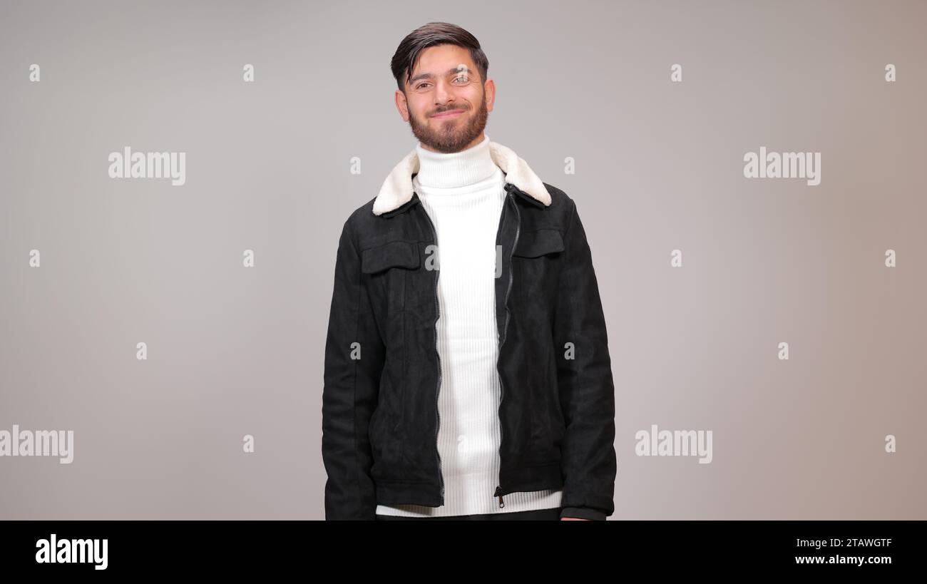 Handsome joyful man standing hi-res stock photography and images - Alamy