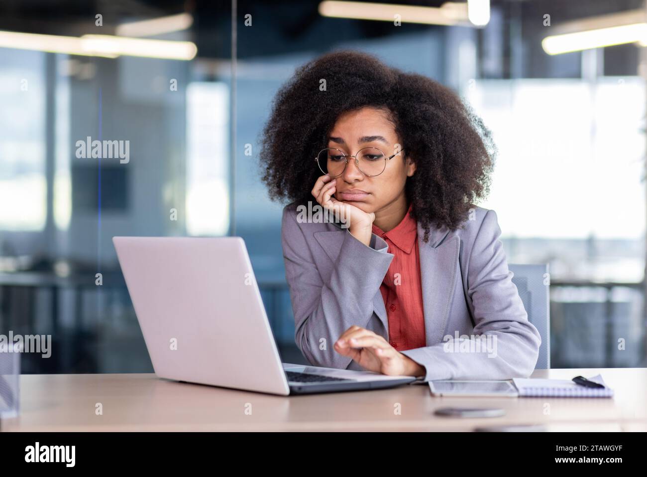 Boring routine daily work in office, businesswoman sitting at desk at ...