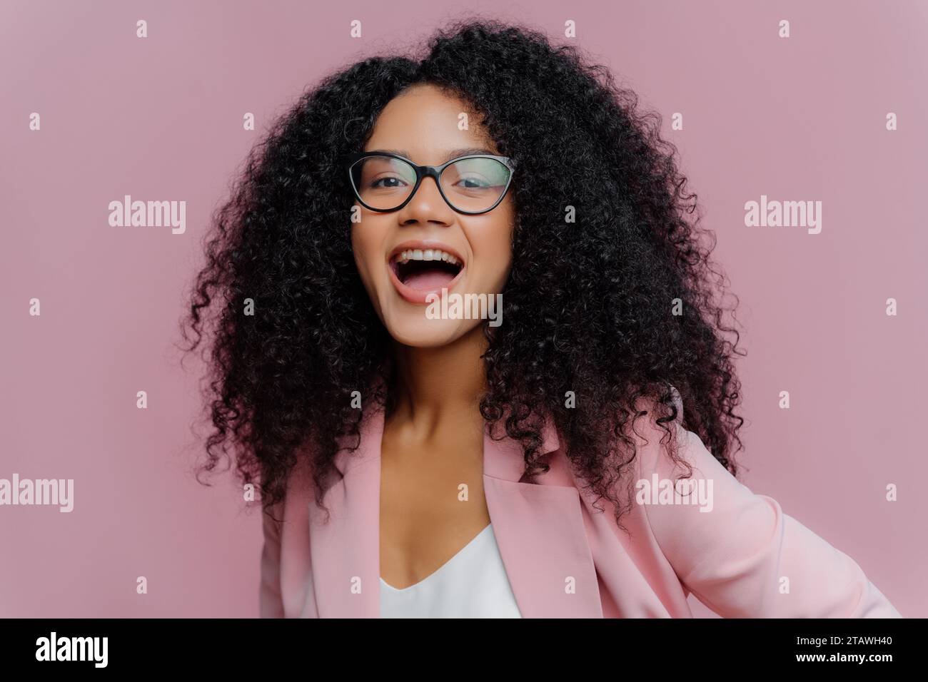 Playful young woman in blazer hi-res stock photography and images - Alamy