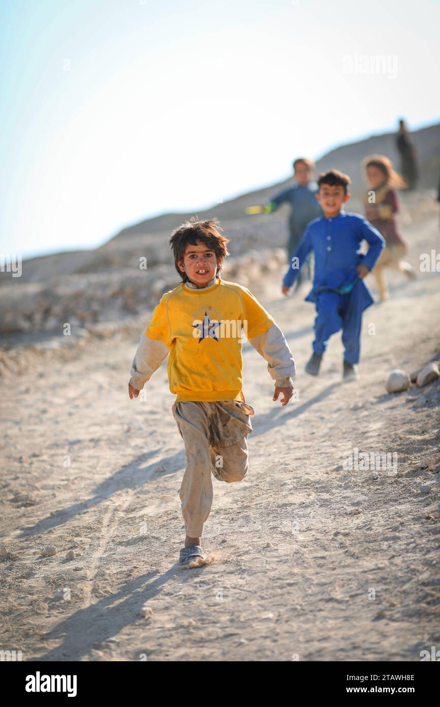Happy Afghan children in need, looking at the camera and smiling Stock ...