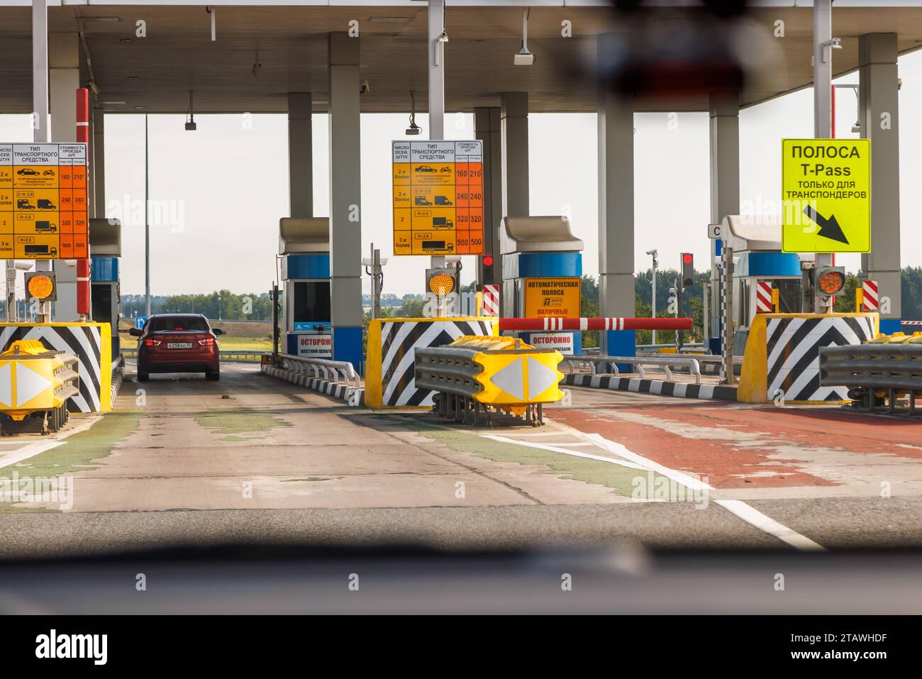 red car passing toll road checkpoint, view from inside a car Stock ...