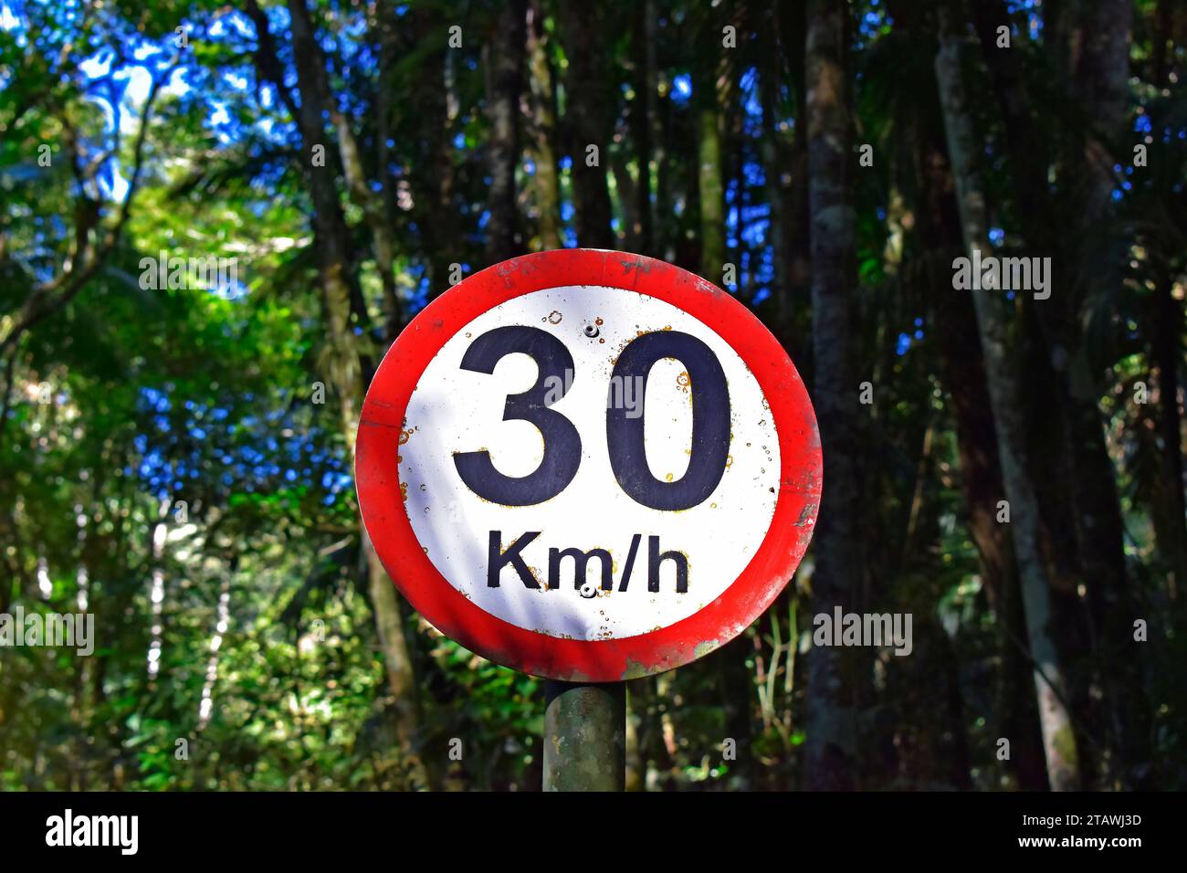 Traffic sign speed limit at 30 kilometers per hour on public park, Teresopolis, Rio de Janeiro ...