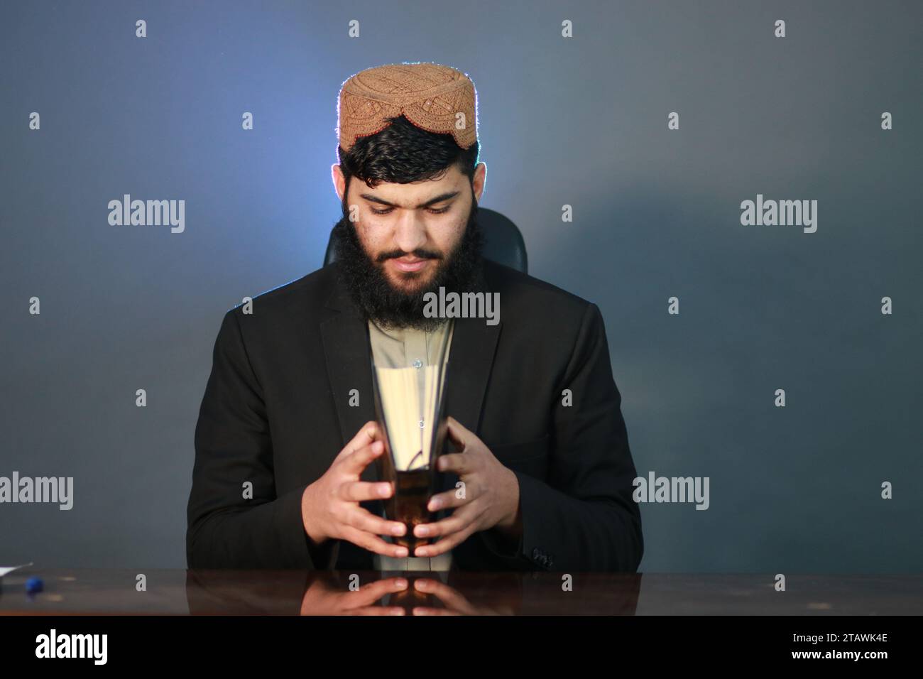 Muslim man reading holy Quran. Holy Quran in Hand with Arabic text ...