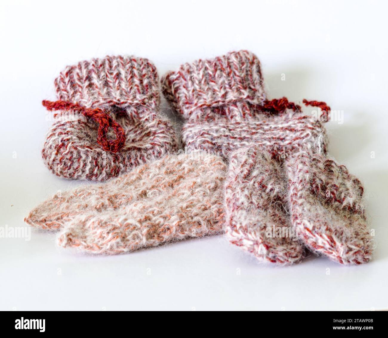 knitted work on a white background, knitted texture, needlework, home ...