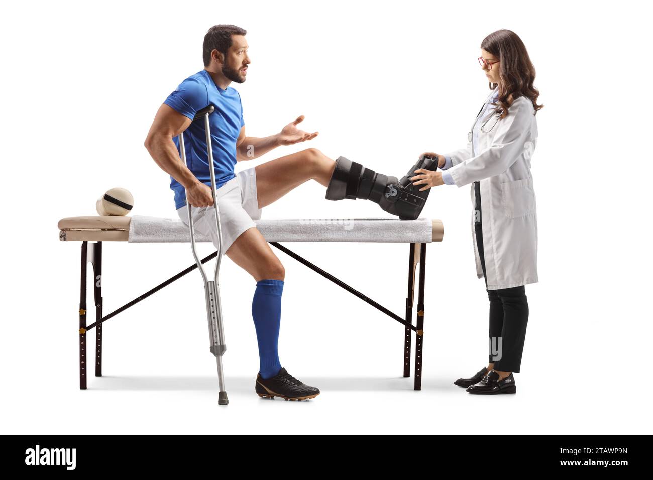 Athlete talking to a female doctor checking his injured foot isolated ...