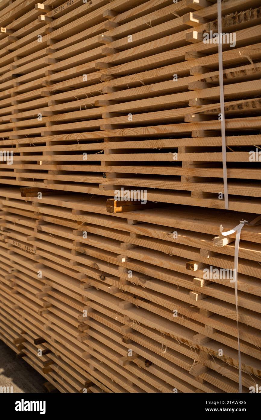 Stacked wooden planks. Wood for air drying timber stack. Hardware store ...