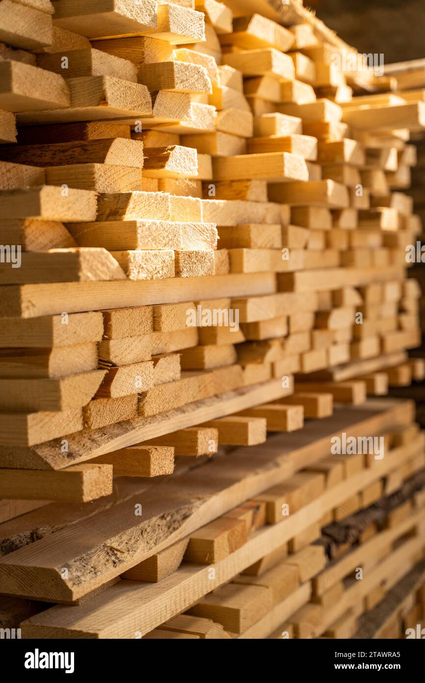 Stacked wooden planks in close-up at lumber warehouse. Air-drying ...