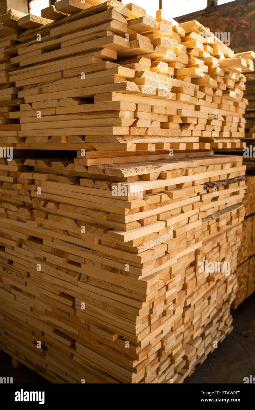 Stacked wooden planks. Hardware store or construction site. Wood for ...