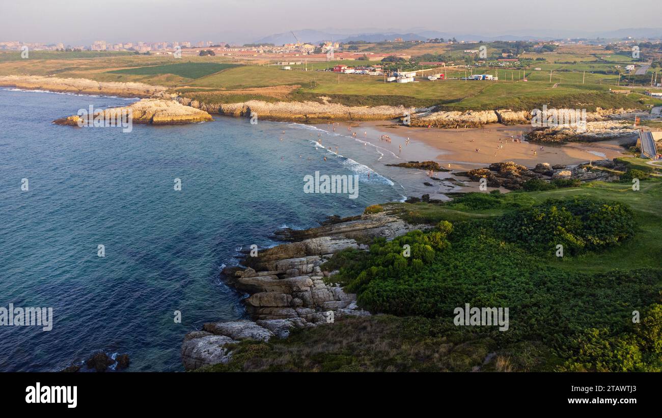 Evening aerial view of Virgen del Mar beach, island, bay, and the city ...