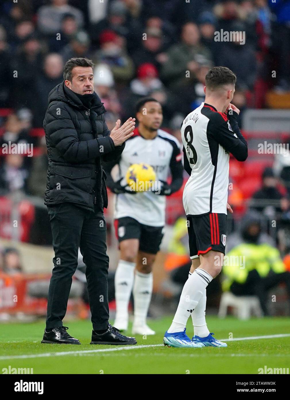 Fulham manager Marco Silva (left) speaks to Harry Wilson (right) during ...