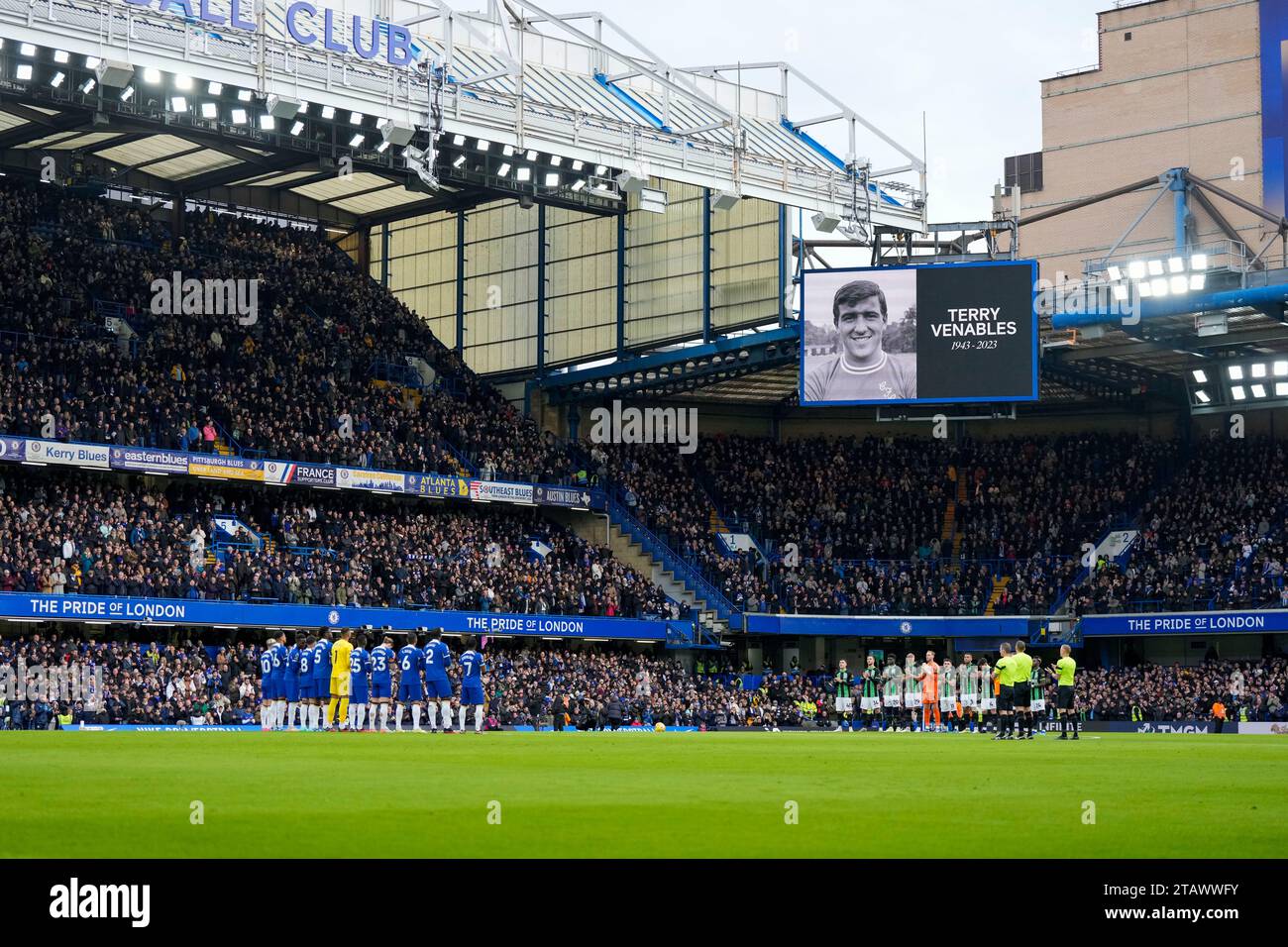 Players and fans applauded as giant screen shows a photo of late ...