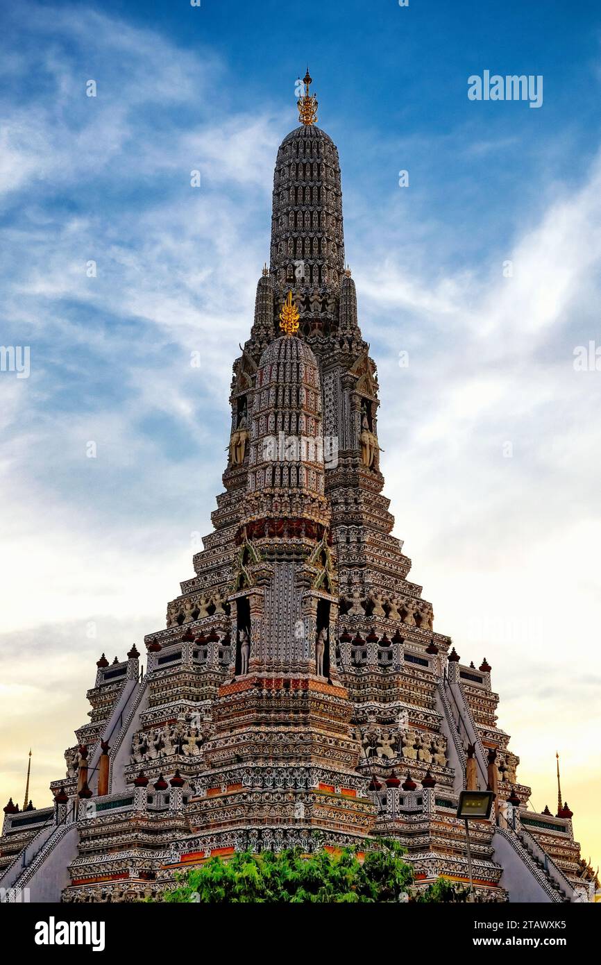 The Wat Arun temple in Bangkok, Thailand. The temple is a tall, ornate ...