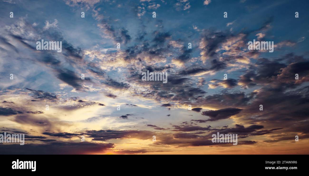 A sky with a pink and orange sunset and a blue hue Stock Photo - Alamy