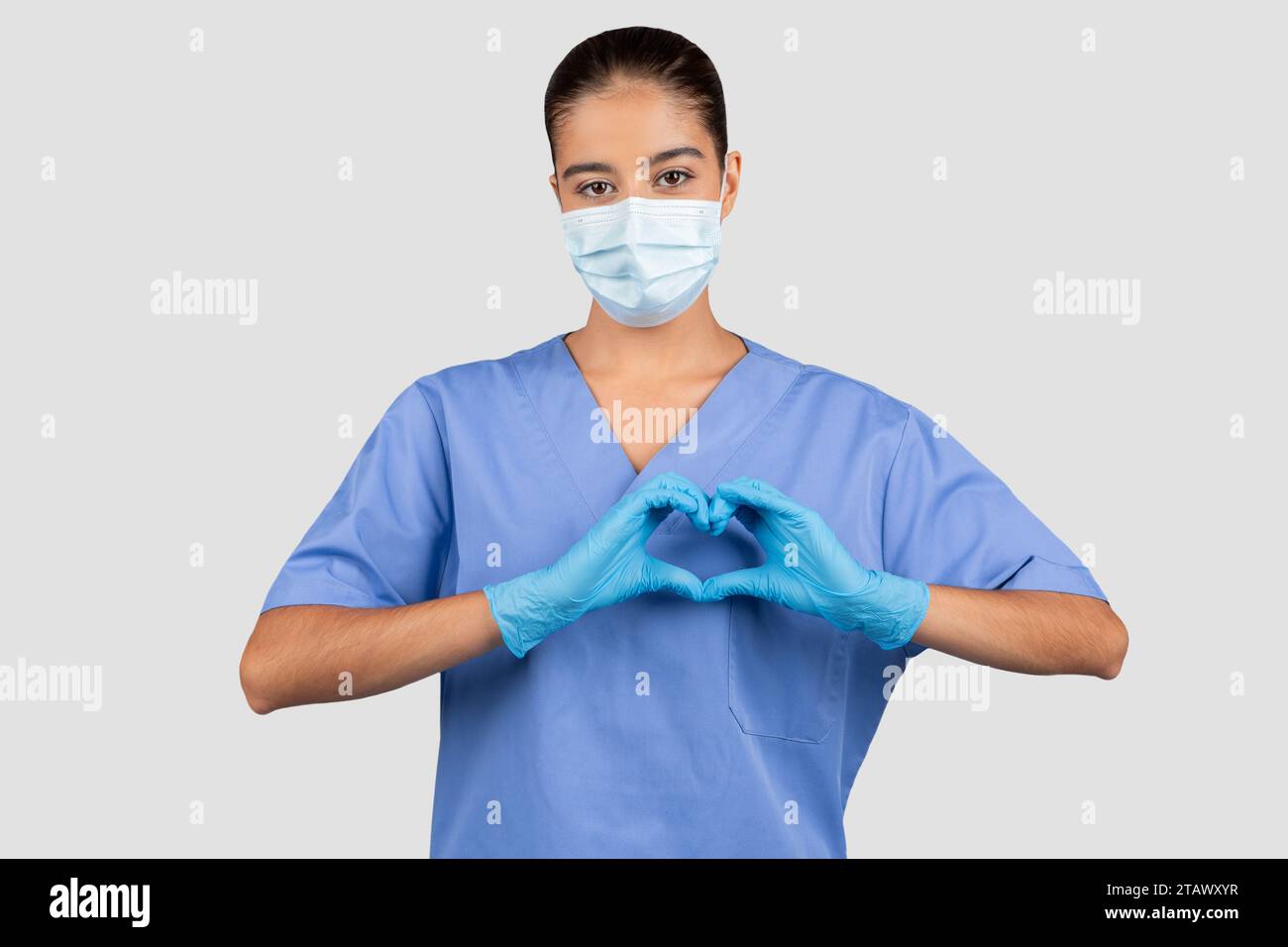Glad european young doctor, nurse cardiologist in blue uniform ...