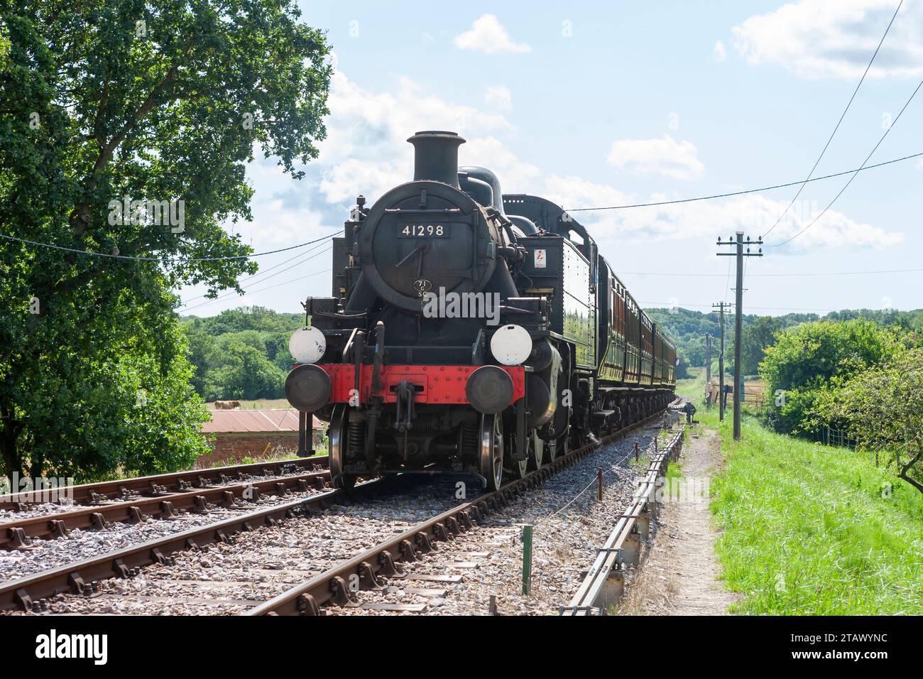 Ivatt Class 2, 41298 tank engine hauls a train into Wootton Station on ...