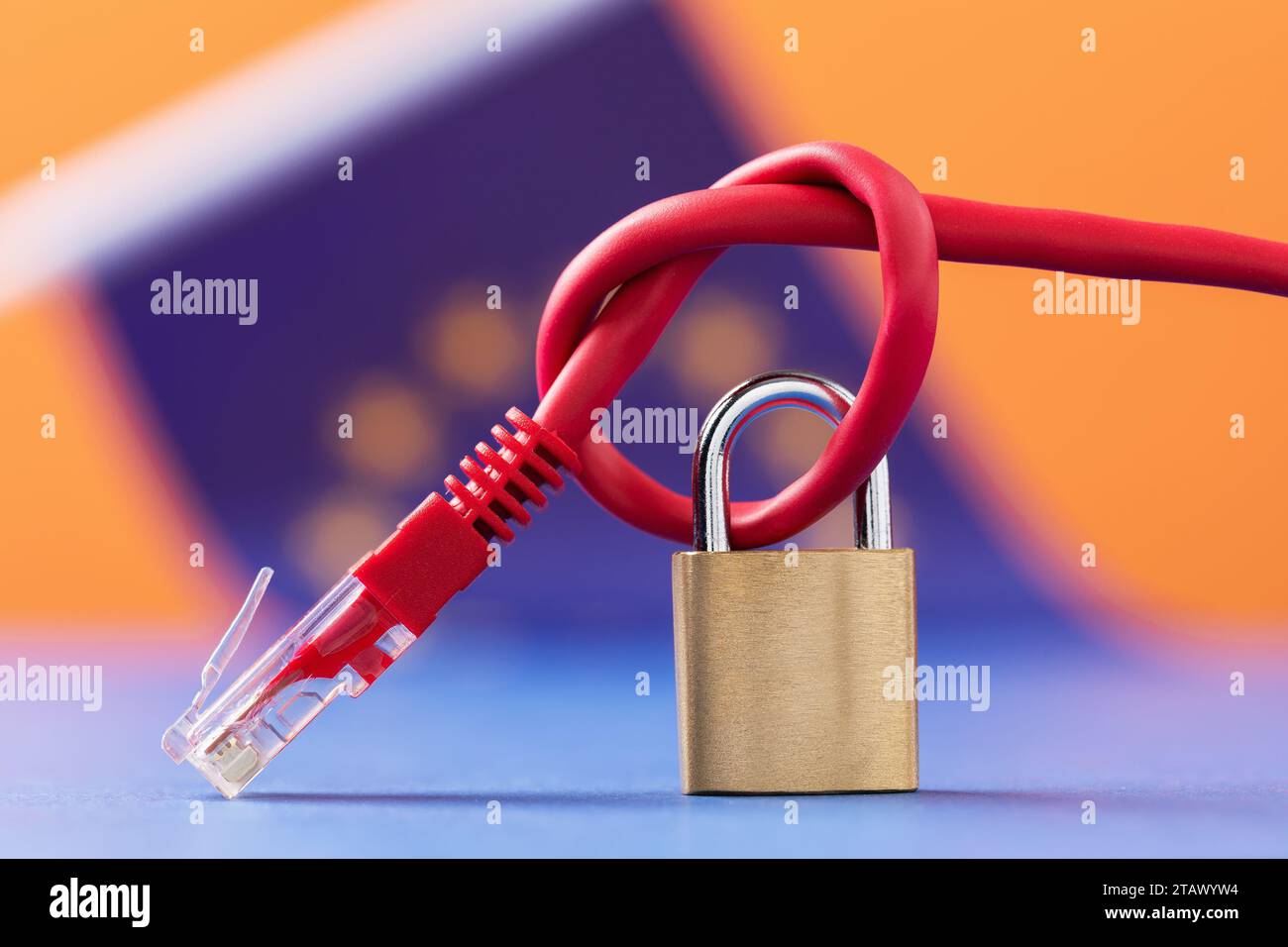 A closed padlock on a tied network wire against the background of the ...