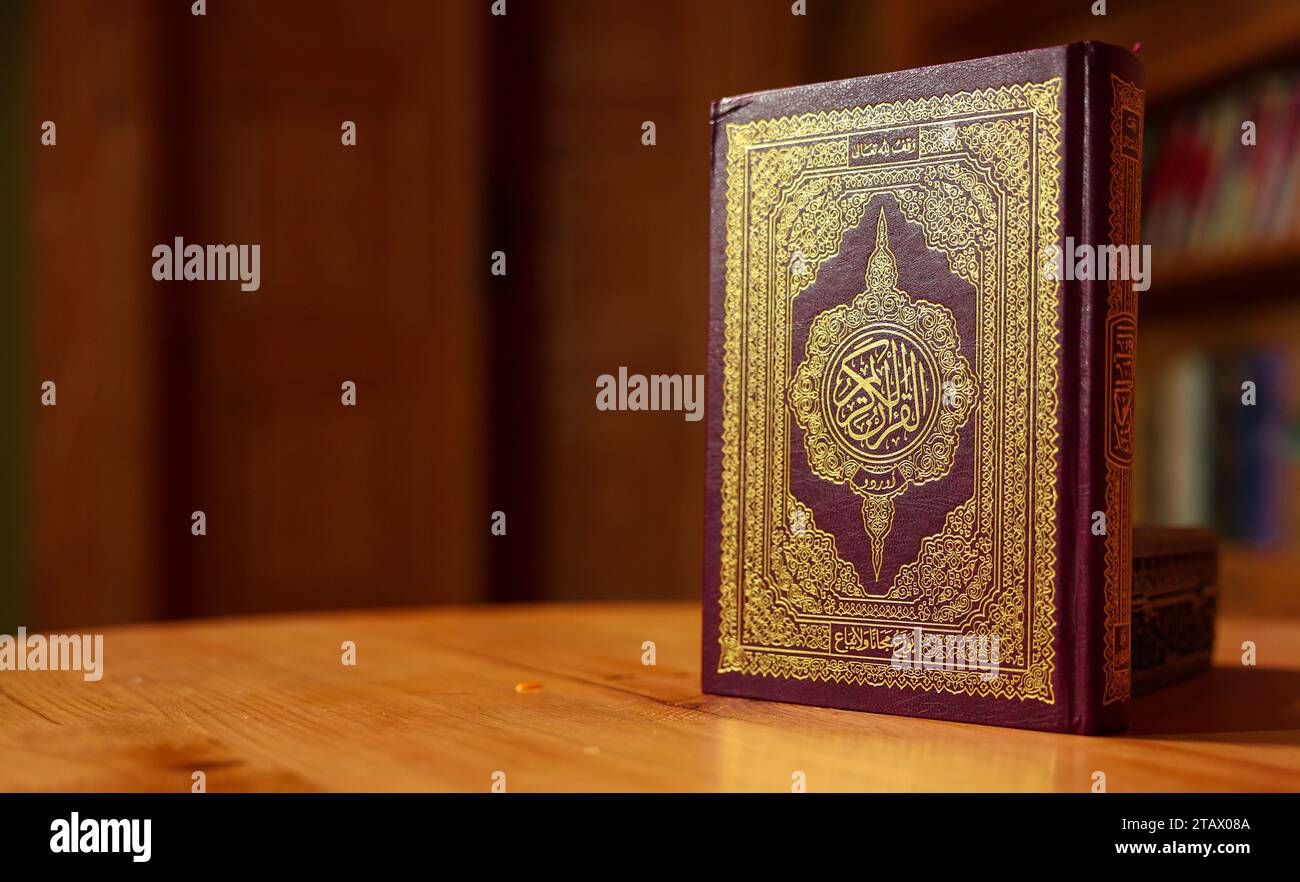 Holy Al Quran with written Arabic calligraphy meaning of Al Quran on ...