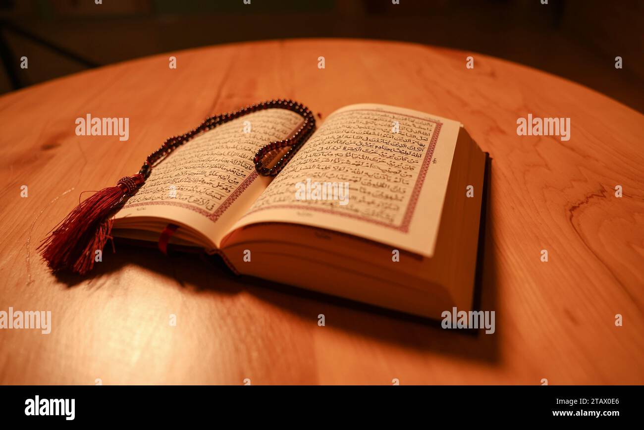 Holy Al Quran with written Arabic calligraphy meaning of Al Quran on ...