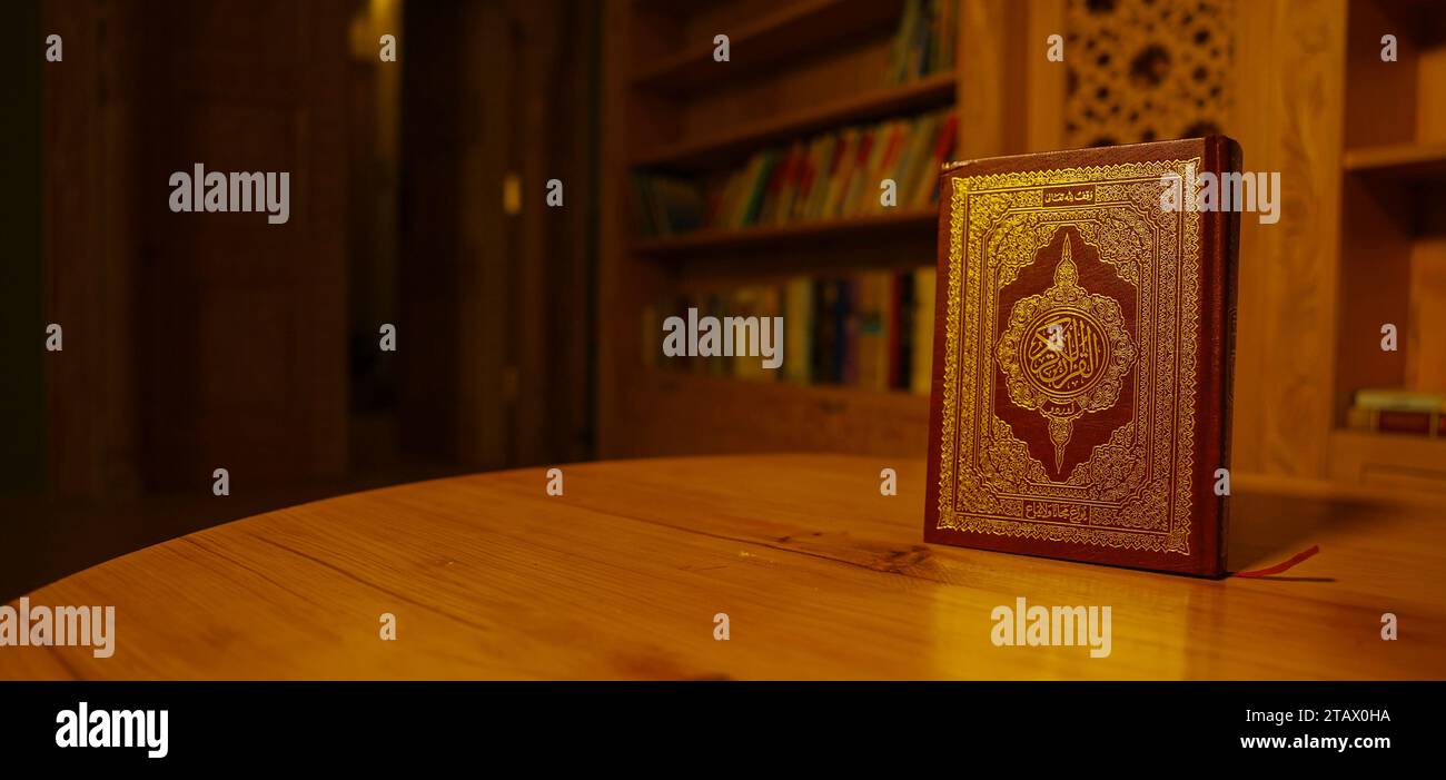 Holy Al Quran with written Arabic calligraphy meaning of Al Quran on ...