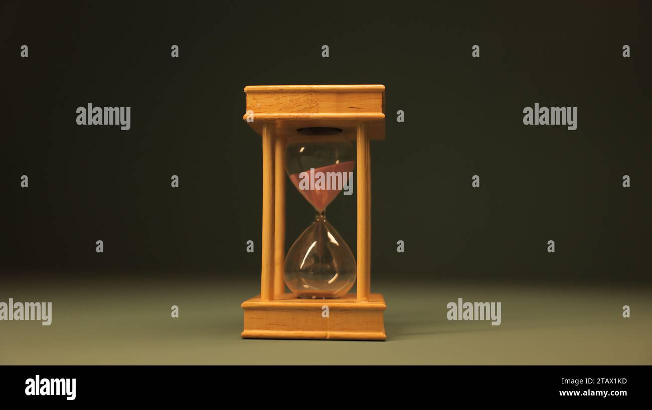 Hourglass against dark background | sandglass, sand timer, or sand ...