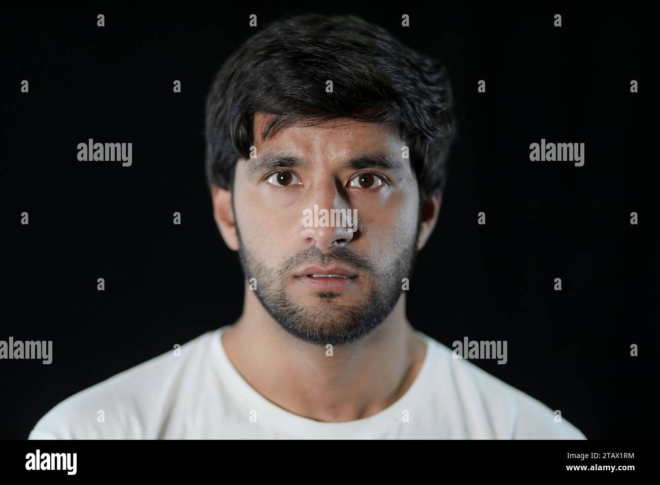 Scared man against dark background, Portrait of a young frightened man ...