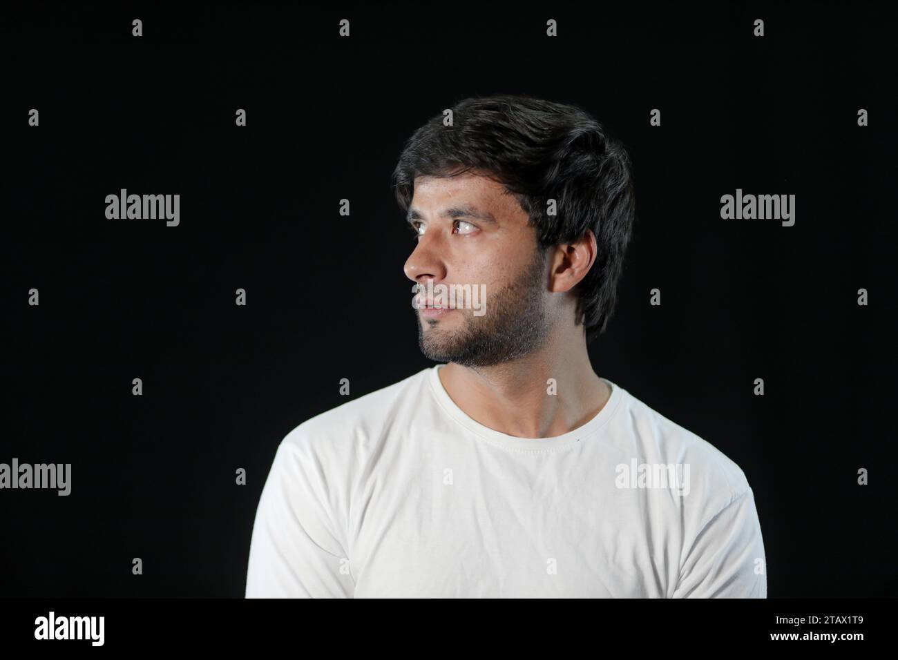 Scared man against dark background, Portrait of a young frightened man ...