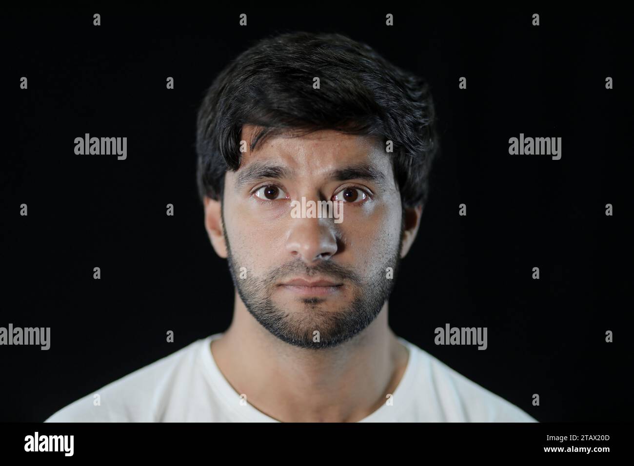 Scared man against dark background, Portrait of a young frightened man ...